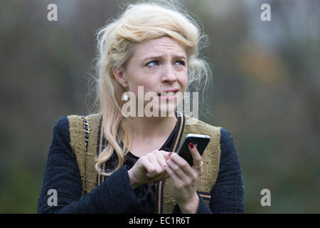 Women experiencing bad mobile phone connection outdoors Stock Photo - Alamy