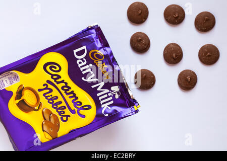 opened packet of Cadbury's Dairy Milk Chocos with chocolates arranged ...