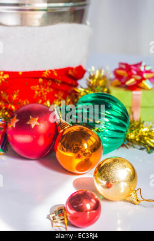 beautiful flowers, gifts and Christmas balls on green background Stock ...