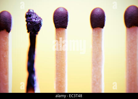 A burnt match between new matches, symbolic image burnout syndrome ...