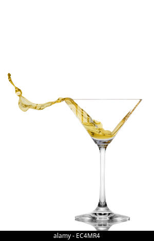 Yellow Martini Spilling out of Glass Stock Photo - Alamy