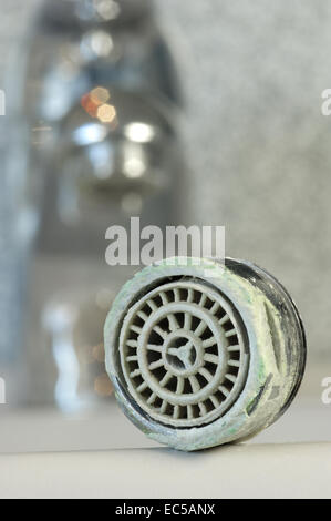 Calcified sieve of a faucet Stock Photo - Alamy