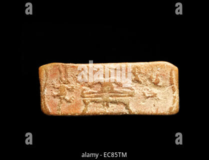 Terracotta seal with a male cult figure; from the Indus Valley ...