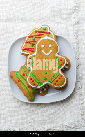 Christmas homemade gingerbread man over wooden background Stock Photo ...