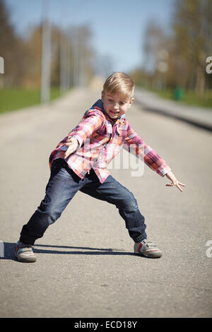 Funny grimacing little boy on white background Stock Photo - Alamy