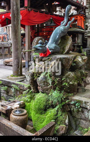 A kitsune (fox spirit) at the shrine of Fushimi Inari-taisha, kami (god ...
