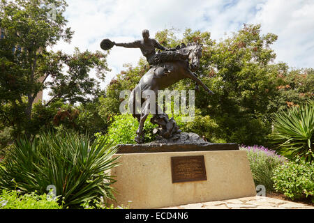 Texas cowboy statue & state Capitol, Austin, TX Stock Photo - Alamy