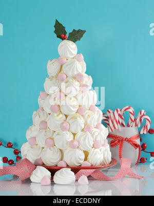 Pavlova dessert in the shape of a Christmas wreath decorated with ...