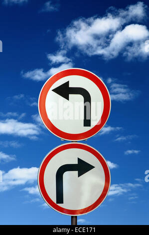 two opposite road signs against blue sky and clouds Stock Photo - Alamy