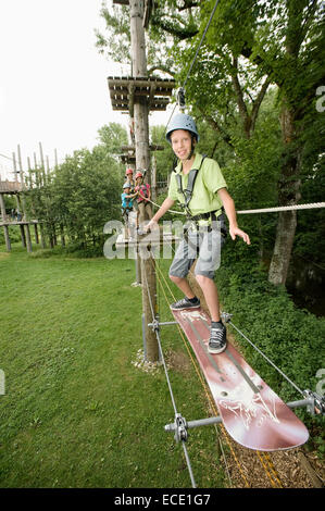 Girls and boys climbing crag, smiling Stock Photo - Alamy