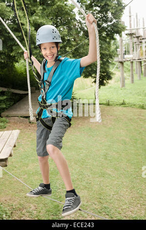Portrait of boy climbing crag, smiling Stock Photo - Alamy