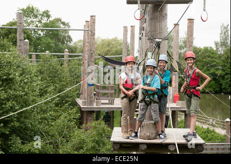 Girls and boys climbing crag, smiling Stock Photo - Alamy