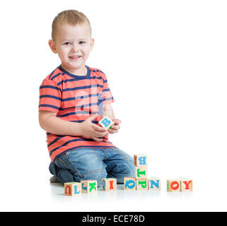Cute little child playing with letters at home Stock Photo - Alamy