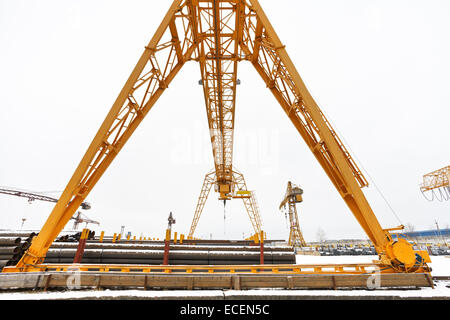 overhead crane over outdoor warehouse with metal products Stock Photo ...