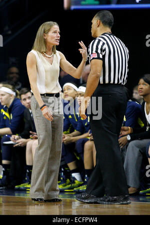 Michigan head coach Kim Barnes Arico reacts to play against Louisville ...