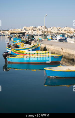 Fishing Nets & Luzzu boats in the harbour at Marsacala Bay, Malta Stock ...