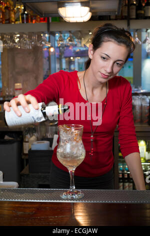Bartender is pouring drink Stock Photo - Alamy