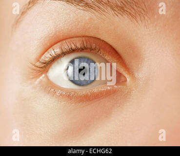 wide open blue pupil close-up Stock Photo - Alamy