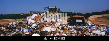 Heavy equipment at work in a sanitary landfill operation Stock Photo ...