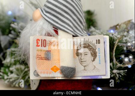 Christmas santa carrying cash England UK Stock Photo - Alamy