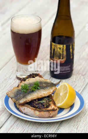 Fish Snack - Pilchard on Toast on white Background Stock Photo - Alamy