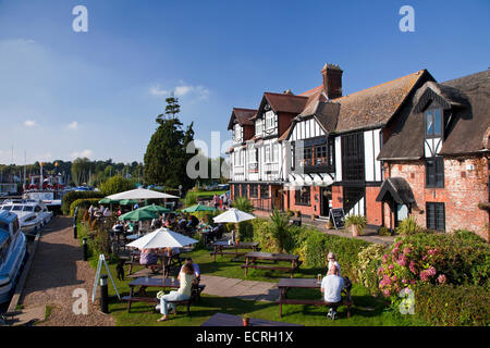 The riverside beer garden of the Swan Inn, Horning, Norfolk. The beer ...