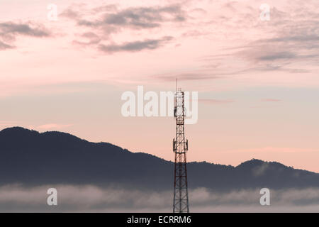 Telecommunication tower and sunset sky background Stock Photo - Alamy