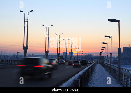 Cars on the bridge at sunset. Omsk. Russia Stock Photo - Alamy