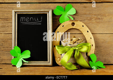 green clover leaves and a bag of gold - symbol of St. Patrick's Day ...