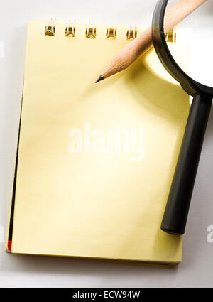 Magnifying glass over open paper book with pages. Concept of academic ...