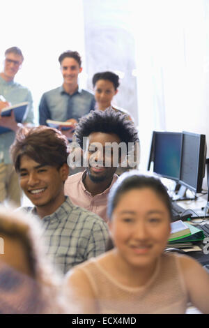 group of smiling students in lecture hall Stock Photo - Alamy