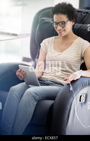 Middle age woman holding t shirt washing clothes at laundry room Stock ...