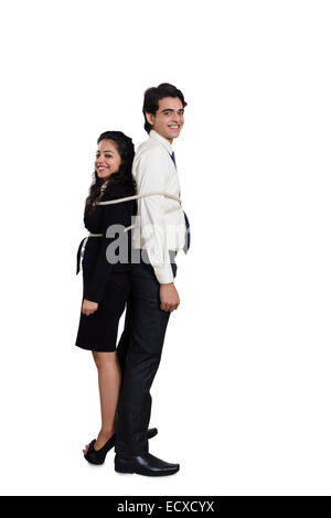 Business man tied up with ropes outdoors Stock Photo - Alamy