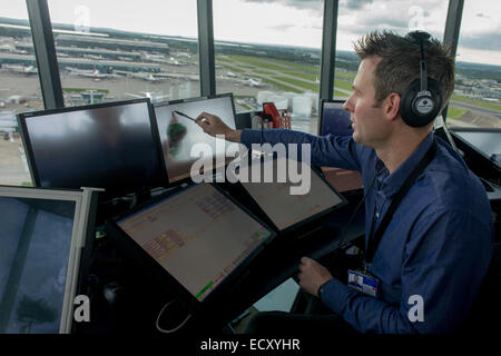 NATS Heathrow air traffic controller in control tower at Heathrow ...