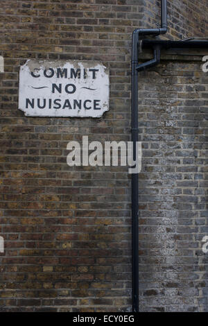 A Victorian-era 'Commit No Nuisance' sign on the wall of a south London ...