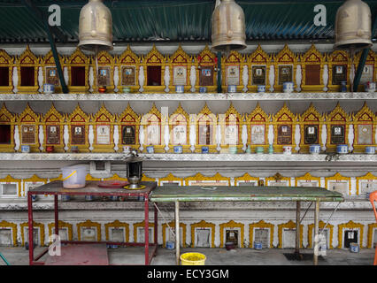 A wall with cremation urns at small Thai Buddhist temple. Bangkok ...