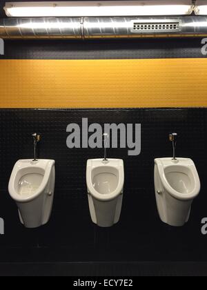 Side by side urinals in a men's restroom Stock Photo - Alamy