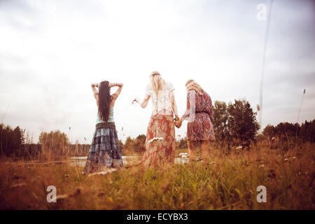 Women standing in field Stock Photo - Alamy