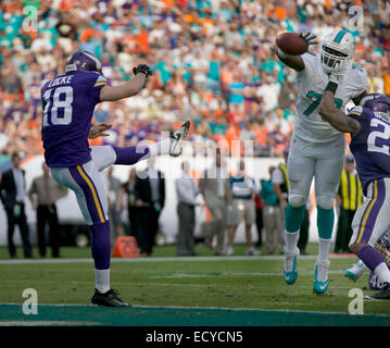 Miami Dolphins defensive end Terrence Fede (78) embraces Jacksonville ...