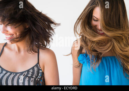 Woman flipping hair Stock Photo - Alamy
