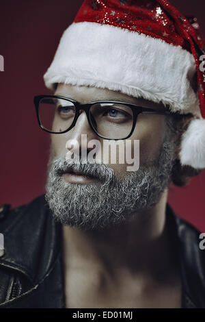 Closeup portrait of serious Santa Claus looking at camera over ...