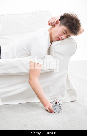 young man expressing negativity on gray background Stock Photo - Alamy