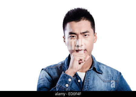 Portrait of suspicious young man Stock Photo - Alamy