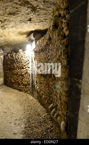 Millions of skulls and bones line the tunnels of the Paris Catacombs ...