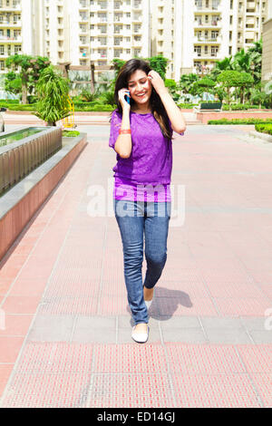 Woman holding mobile phone, block chain with graph of stock market ...