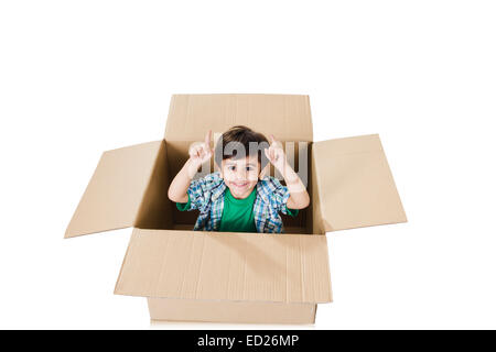 1 indian child boy playing Carton Box Stock Photo - Alamy