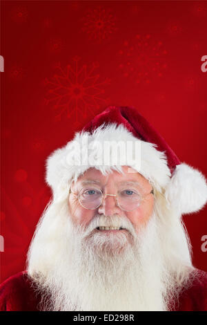 Composite image of santa smiles in the camera Stock Photo - Alamy
