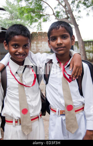 Two boys school class 9-10 year olds old laughing in classroom ...