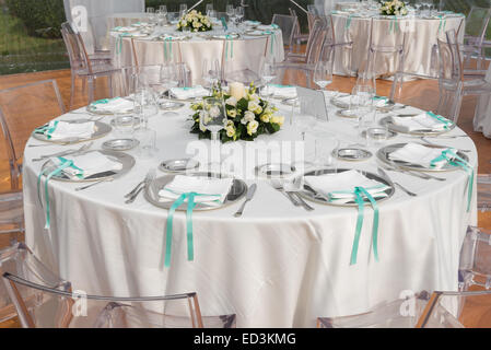 Table set for an event party or wedding reception decorated with pearls ...