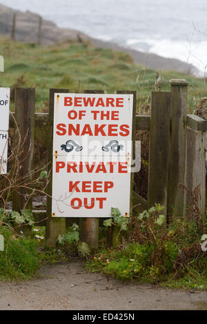 Beware of Dangerous Snakes Sign Stock Photo - Alamy